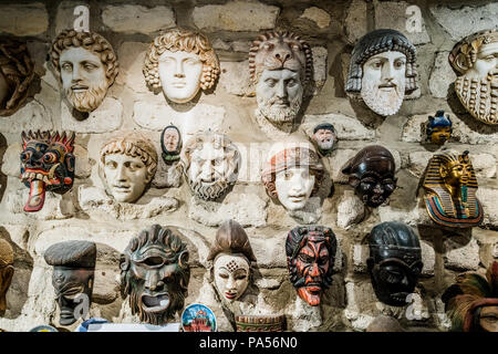 masks hanging on wall. Collection of masks Stock Photo - Alamy