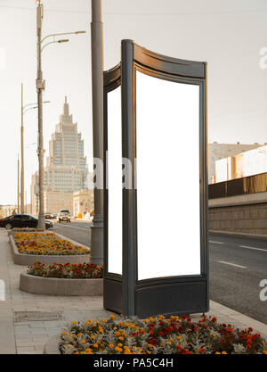 Blank vertical street advertising pillar with city background Stock ...