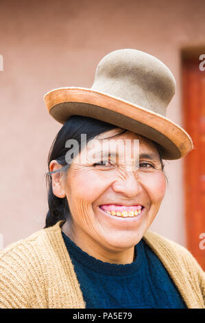 Indigenous Peruvian Quechua lady in traditional clothing with her ...