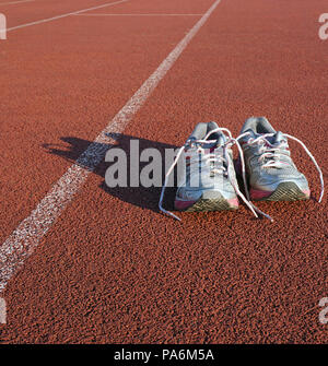 runners at cinder track Stock Photo - Alamy