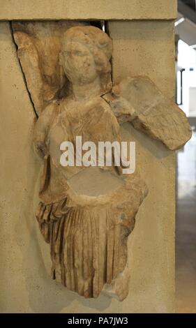 Greek art. The parapet of the Athena Nike temple. Lower part of a Nike ...