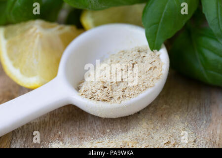 Table spoon of nutritional yeast for making vegan pesto Stock Photo - Alamy