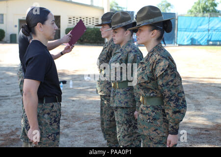 Commanding Officer of Recruiting Station Los Angeles, Maj. Aixa Dones, leads Marine enlistees of ...