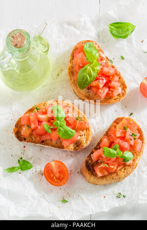 Fresh tasty bruschetta on white background Stock Photo - Alamy