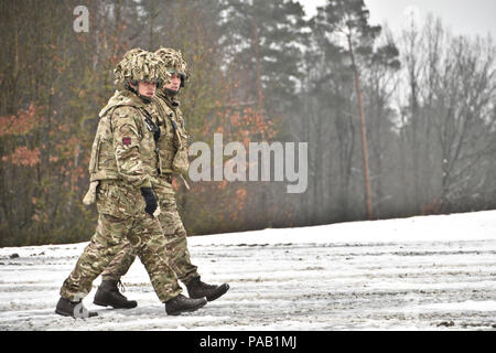 Soldiers from the 22nd Engineer Regiment, British Army, walk toward ...