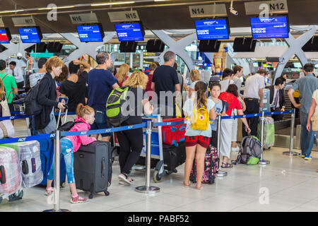 Check-in counters in busy departure lounge at Heathrow airport Stock ...