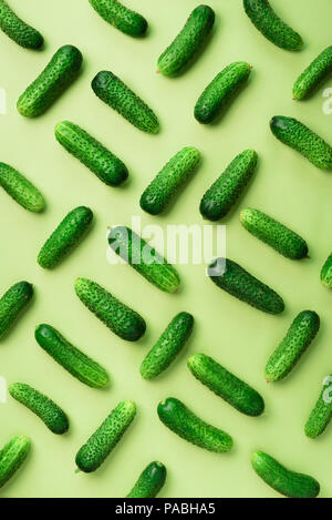 Cucumber pattern. Cucumbers on a green background. Vegetables food ...