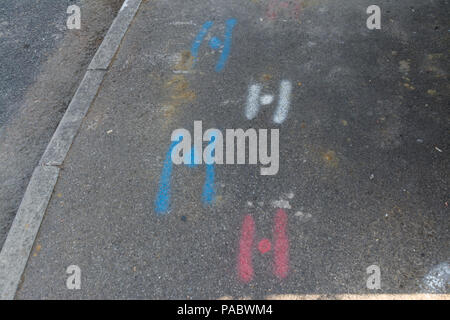 Colourful pavement spray paint markings for utility cables ...