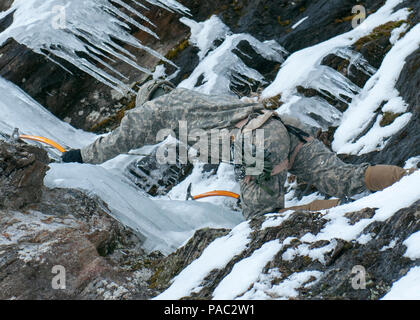 U.S. Army Soldier ice climbs during sustainment training conducted by ...