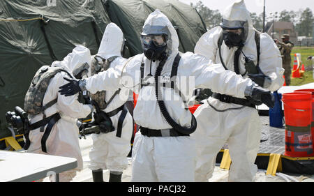 U.S. Soldiers assigned to the 21st Chemical Company, perform self ...