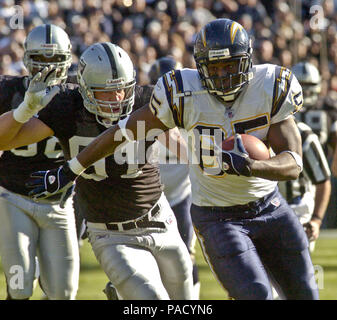 Oakland Raiders' Tyler Brayton, #91, tackles San Diego Chargers ...