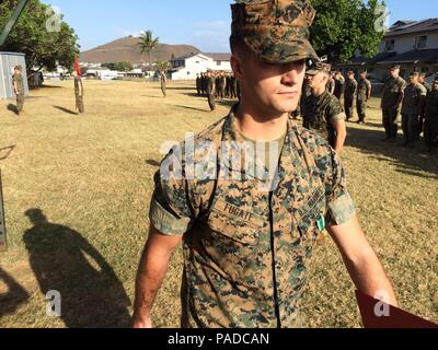 Cpl. Justin Fugate marches back into formation after being awarded the ...