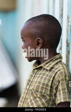 Gabon, Libreville, portrait of a boy with traditional makeup during ...