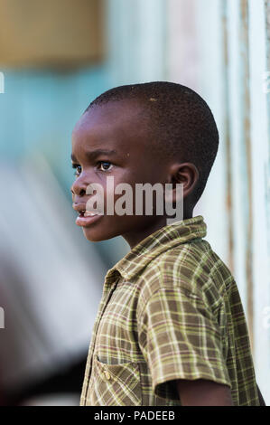 Gabon, Libreville, portrait of a boy with traditional makeup during ...