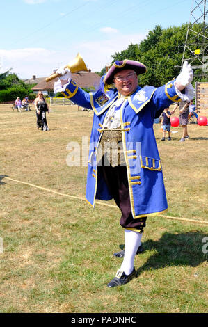 Male town crier & bellman (blue crier's livery & clothes) making loud ...