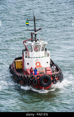LIBREVILLE, GABON - MAR 6, 2013: Small boat sails near the port of ...