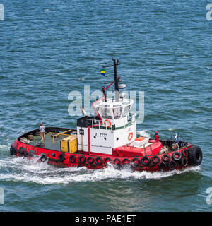 LIBREVILLE, GABON - MAR 6, 2013: Small boat sails near the port of ...
