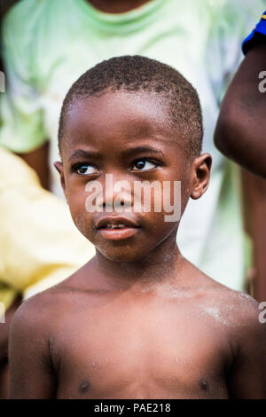 Gabon, Libreville, portrait of a boy with traditional makeup during ...