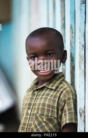 Gabon, Libreville, portrait of a boy with traditional makeup during ...