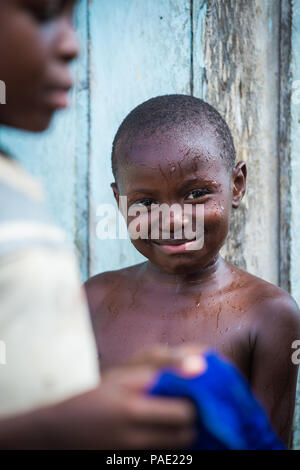Gabon, Libreville, portrait of a boy with traditional makeup during ...