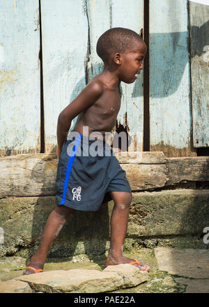 Gabon, Libreville, portrait of a boy with traditional makeup during ...