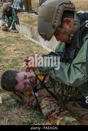 U.S. Navy Seal combat diver equipped with night vision prepares for ...