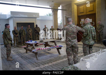 Division Chaplain (Lt. Col.) David Bowlus hugs his son Andrew, while ...