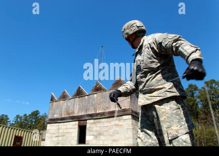 U.S. Army soldiers from the 3rd Infantry Division stand in formation ...
