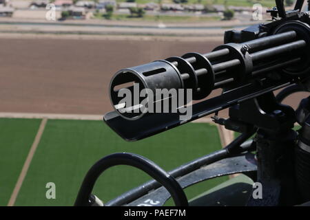GAU-17 or M134 Minigun mounted on a military helicopter. An ...
