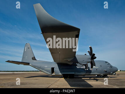 A modified MC-130J waits for its next mission as another C-130 lifts ...