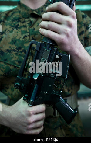 A Marine recruit stands at port arms during an inspection at the Marine ...