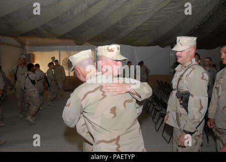 US Navy Newly promoted chief petty officers stand at attention as they ...