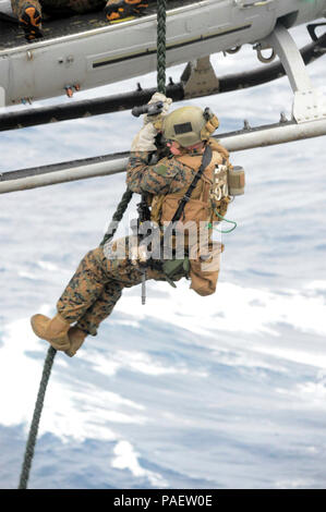 U.S. Marine fast-ropes from a tower aboard Marine Corps Base Hawaii ...