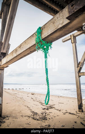 Old rope hanging from a wooden fence Stock Photo - Alamy
