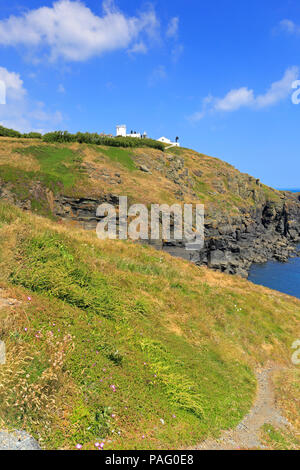 The Lizard Lighthouse on the South West coast path on top of cliffs at ...