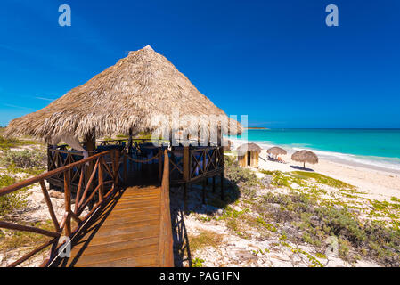 The bridge to the sandy beach Playa Paradise of the island of Cayo ...