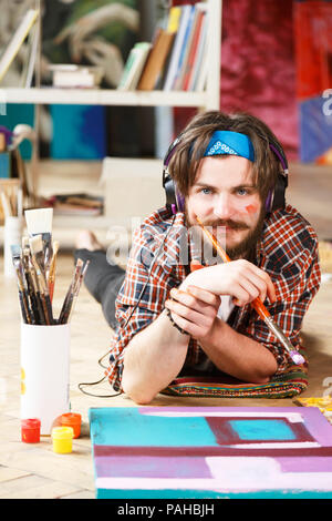 Blue pencil lies on blue paper background Stock Photo - Alamy