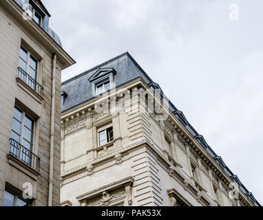 typical architecture in Paris with attics Stock Photo - Alamy