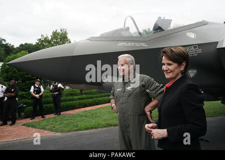 Chief test pilot Alan Norman poses in front of a full scale model of a ...