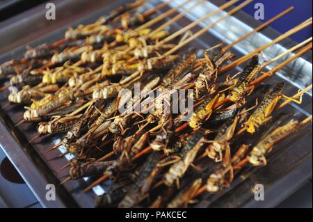 China. 24th July, 2018. Qingdao, CHINA-Fried insects including ...