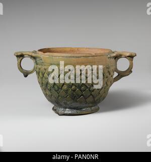 Terracotta lead-glazed skyphos. Culture: Roman. Dimensions: H. 10.2 cm ...