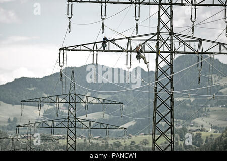 Installer during installation of high-voltage power line Stock Photo ...