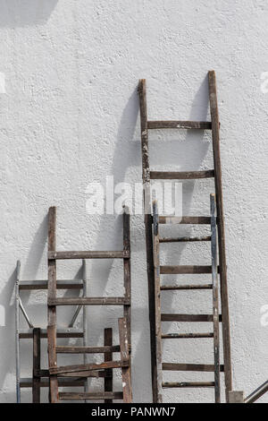 Step ladder leaning against a window Stock Photo - Alamy