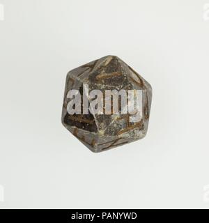 A twenty sided polyhedral die on a slate surface. These type of dice ...