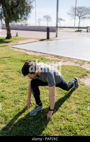 Sportive young man jogging meadows sunny summer Stock Photo - Alamy