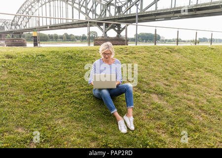 senior woman work on laptop Stock Photo - Alamy