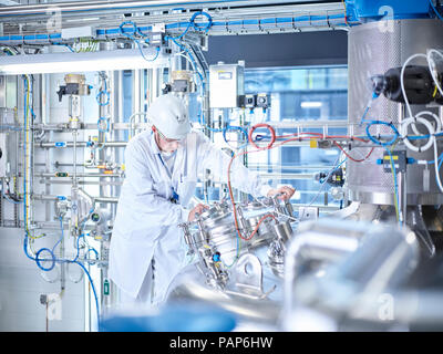 technicians working in industrial chemical plant, norfolk, england ...