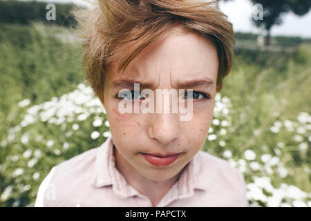 Portrait of an annoyed boy Stock Photo - Alamy