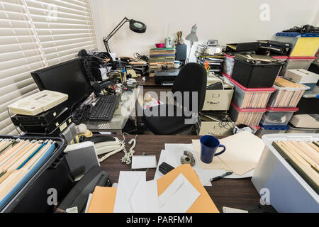 Messy office desk and table with piles of files and disorganized ...