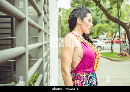 Girl modeling in street with colorfull dress Stock Photo - Alamy